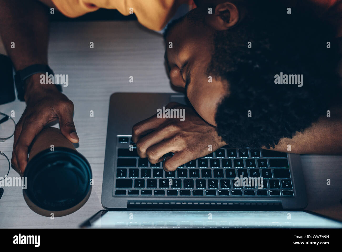 exhausted african american programmer sleeping on keyboard Stock Photo ...
