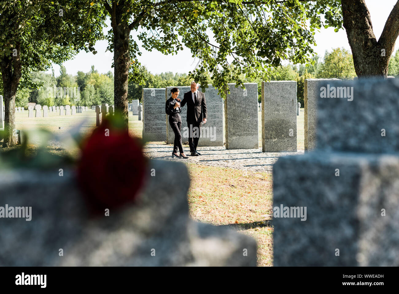 Woman walking in cemetery hi-res stock photography and images - Alamy