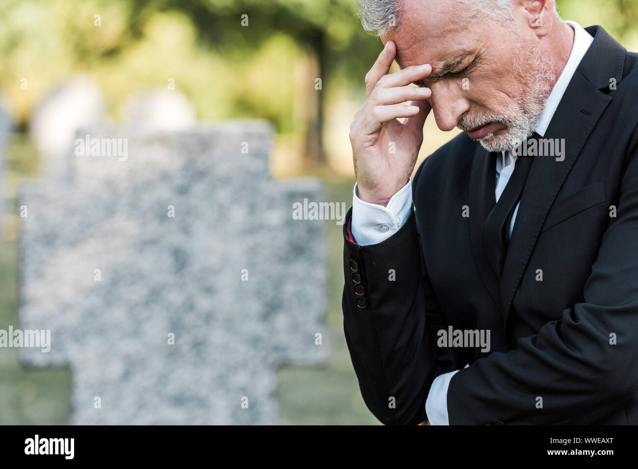 upset senior man touching face on funeral Stock Photo - Alamy