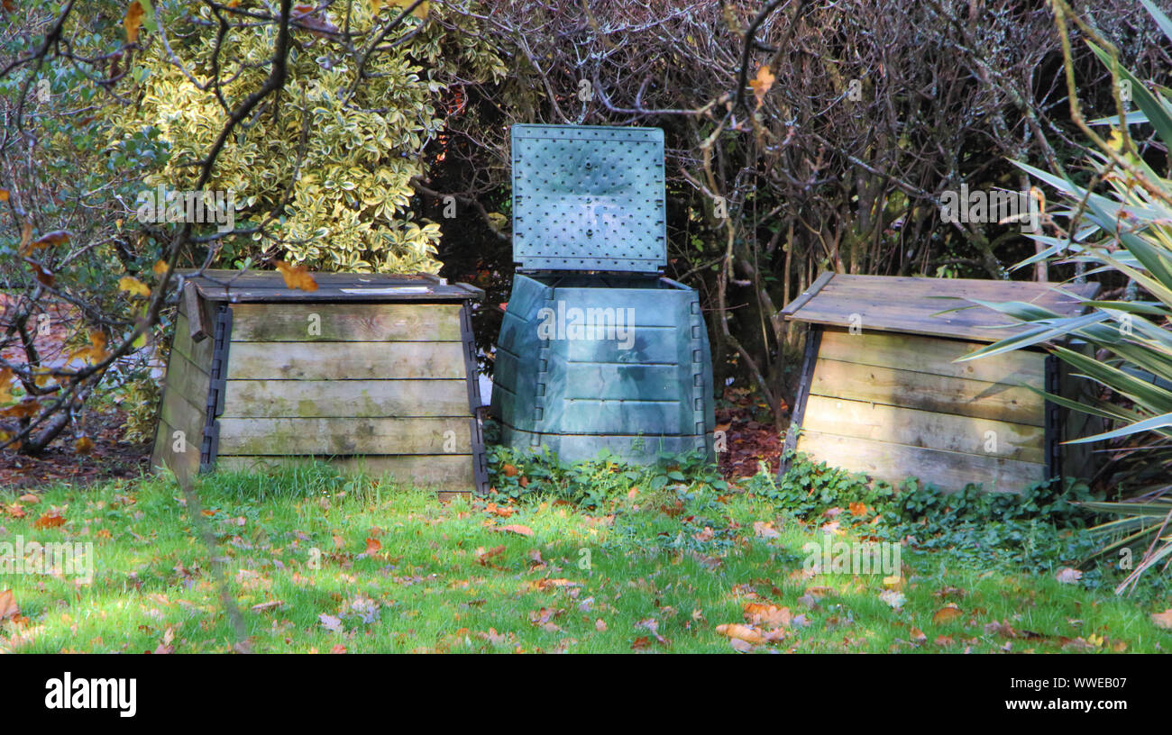 Different types of composter in wood or plastic in a garden Stock Photo ...