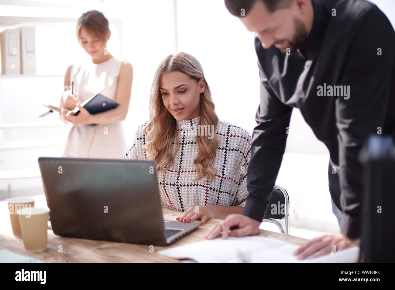 young woman uses a laptop for office work Stock Photo - Alamy