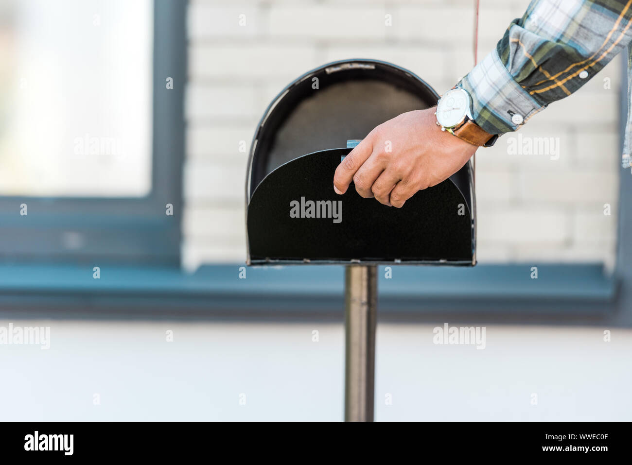 Man opening mailbox hi-res stock photography and images - Alamy