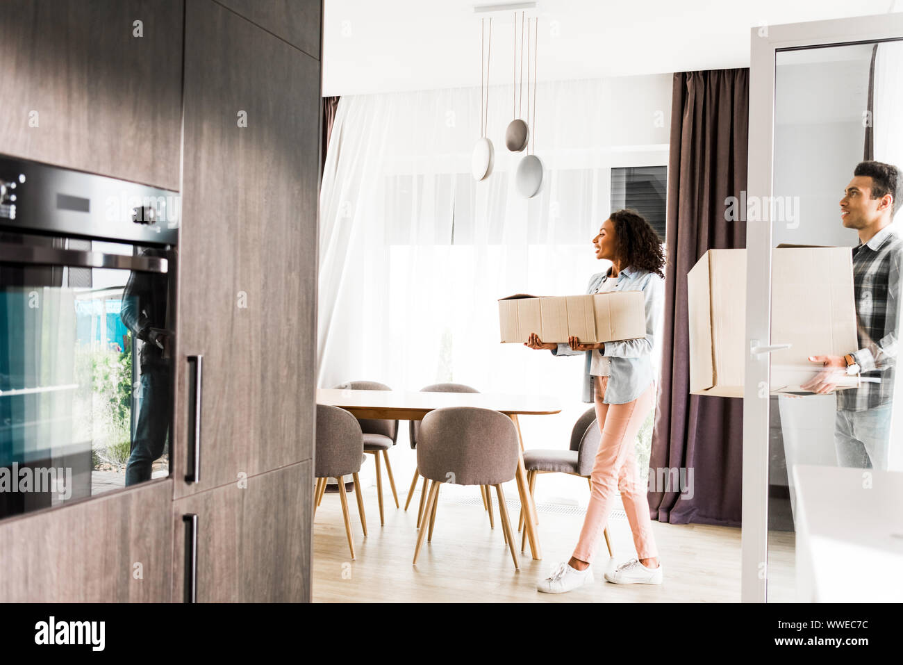 Woman Walking Into Room Full Of People High Resolution Stock ...