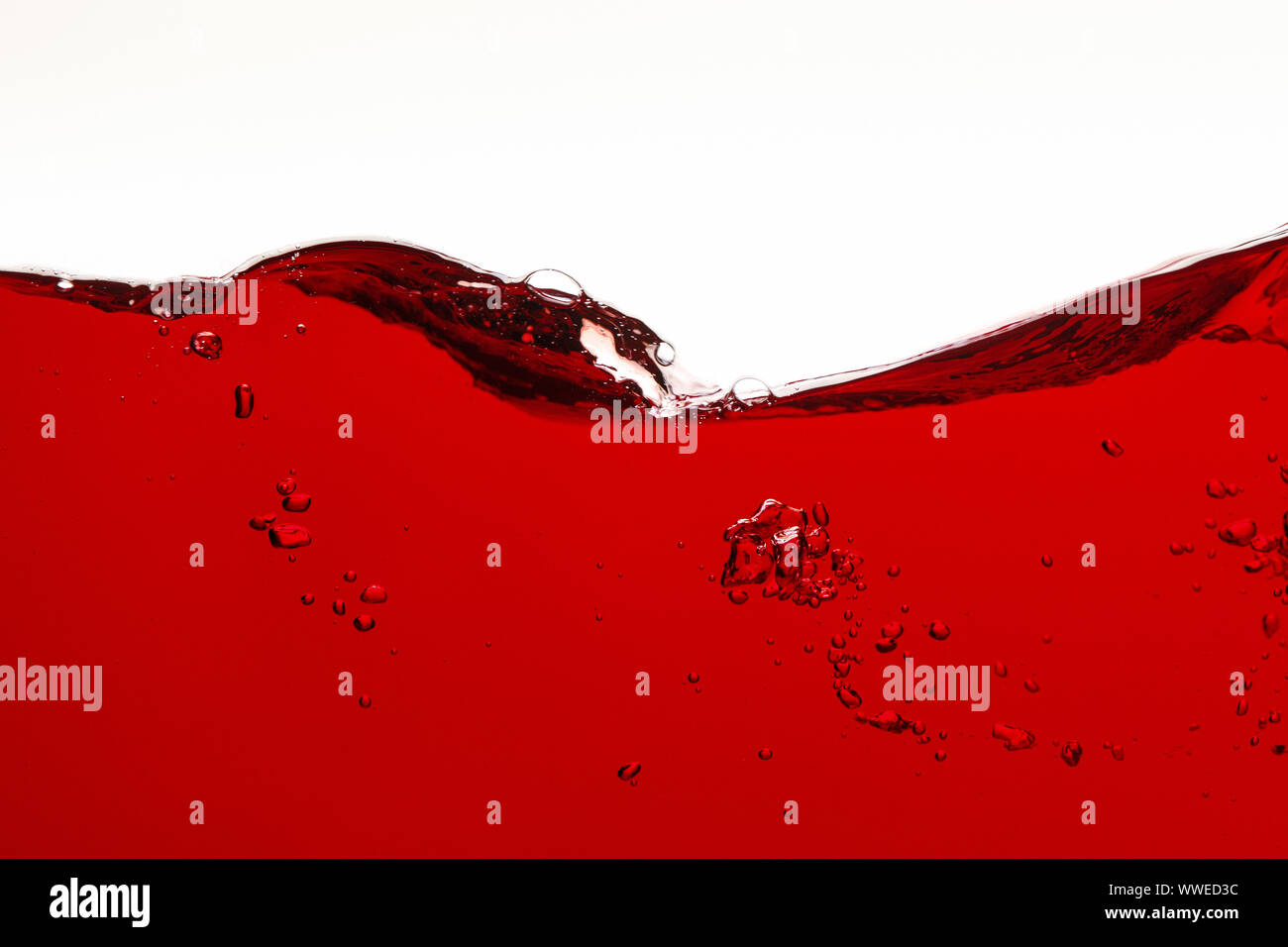 red colorful wavy liquid with bubbles isolated on white Stock Photo - Alamy
