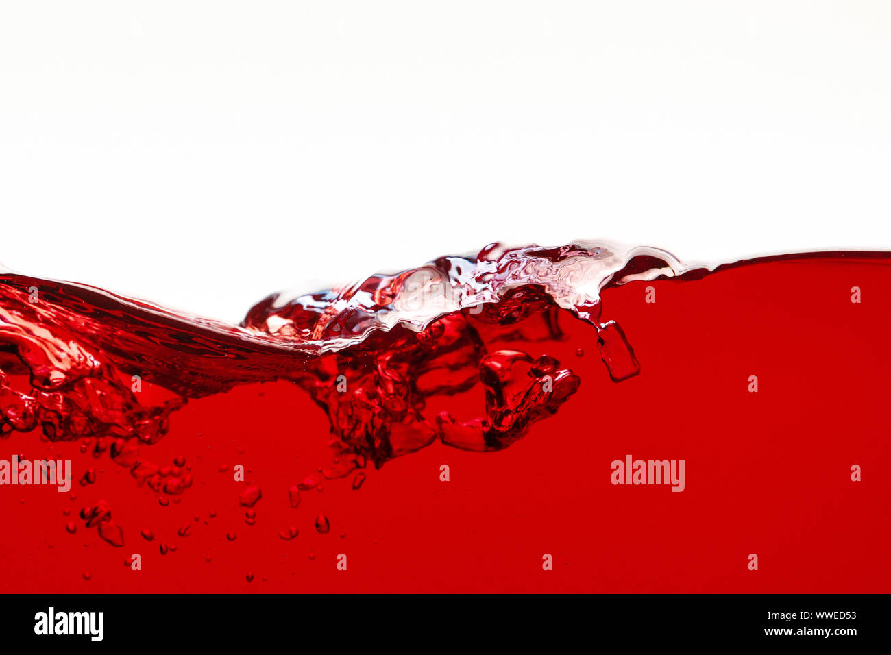 red bright liquid with splash isolated on white Stock Photo - Alamy