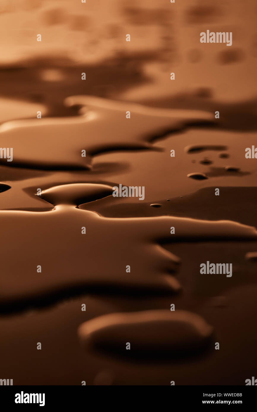water puddles and drops on brown surface Stock Photo - Alamy