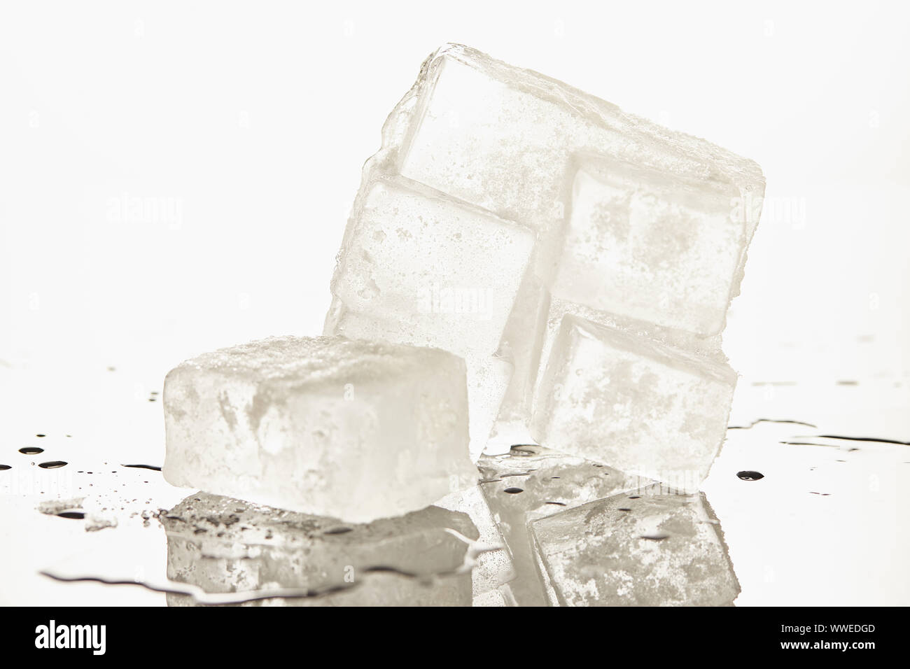 stack of transparent melting ice cubes on white background Stock Photo ...