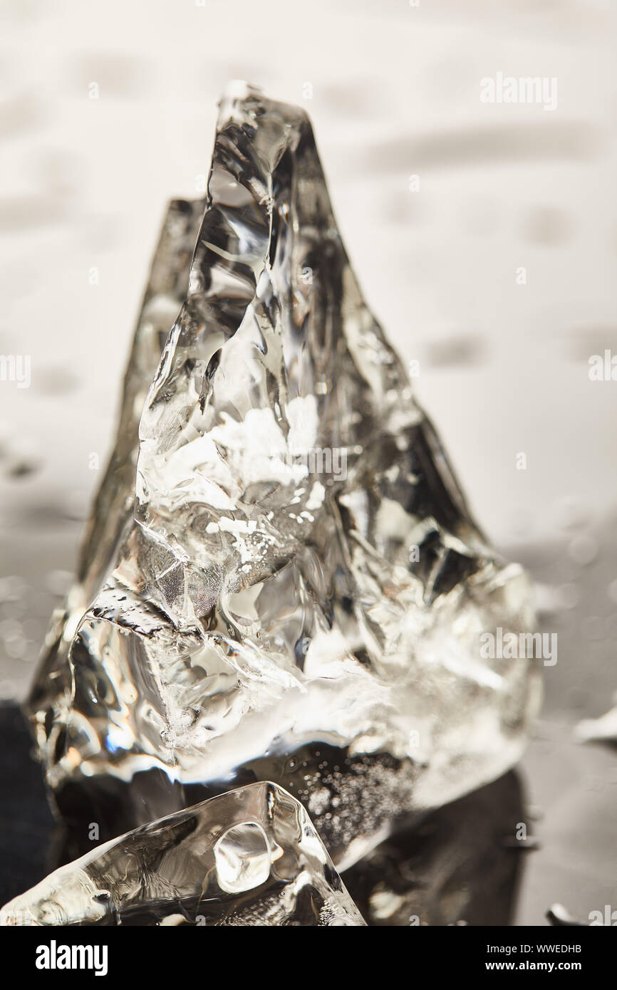 Ice cube melting puddles water hi-res stock photography and images - Alamy