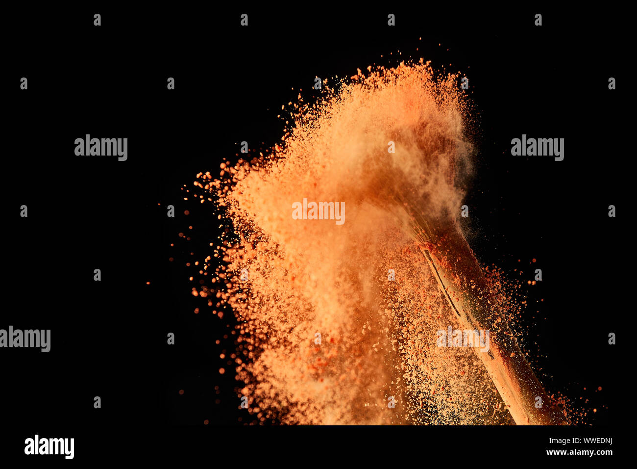 cosmetic brush with colorful paint explosion on black background Stock ...