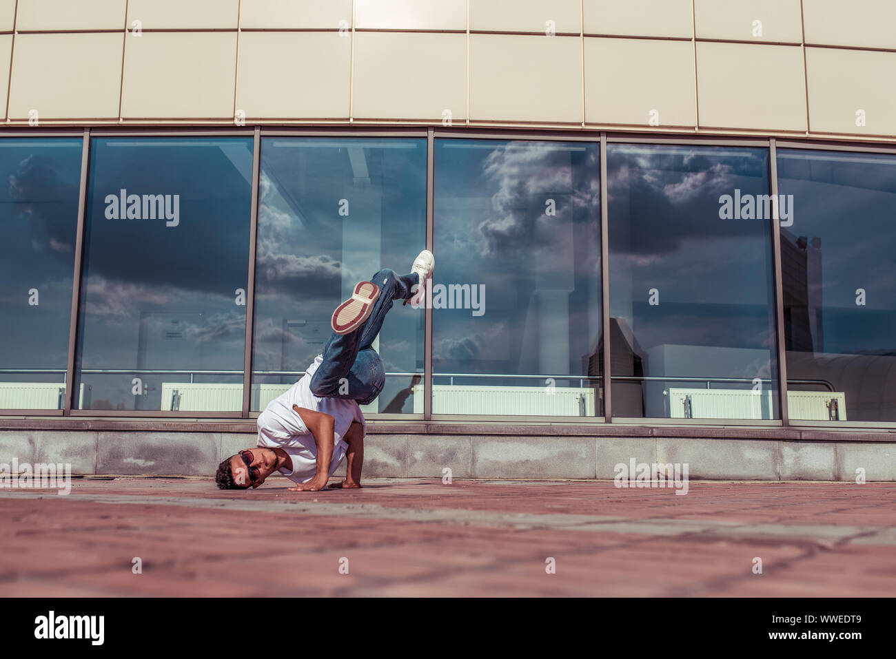 Young stylish man window cloud guy dancer, summer city, dancing break ...