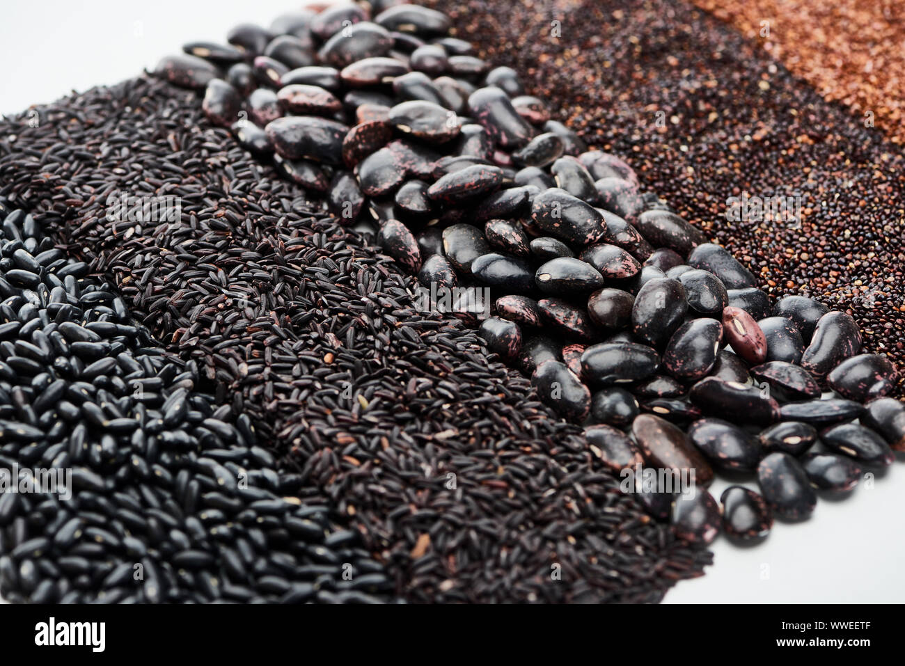 assorted black beans, rice and quinoa isolated on white Stock Photo - Alamy
