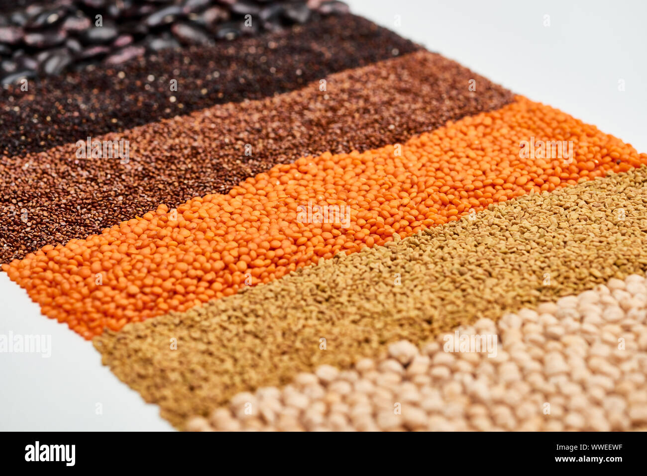 rows with raw legumes and grains isolated on white Stock Photo - Alamy