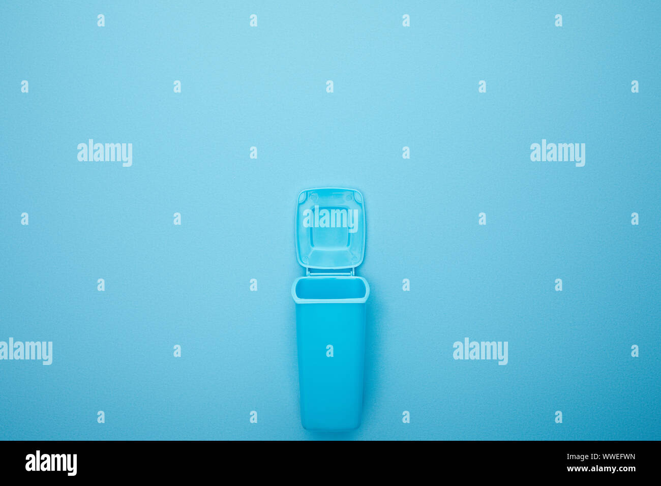top view of open blue recycle bin on blue background Stock Photo - Alamy