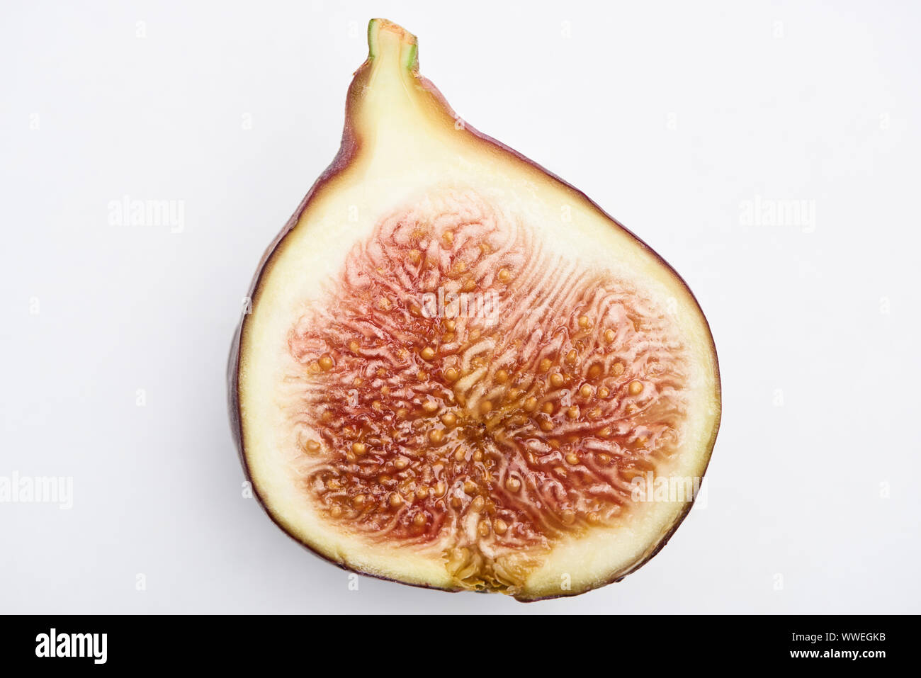 ripe delicious fig half on white background Stock Photo - Alamy