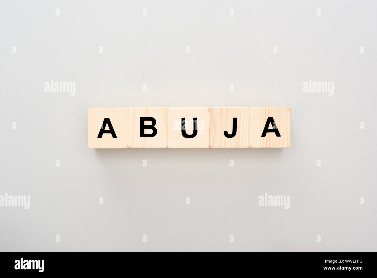 top view of wooden blocks with Abuja lettering on grey background Stock ...