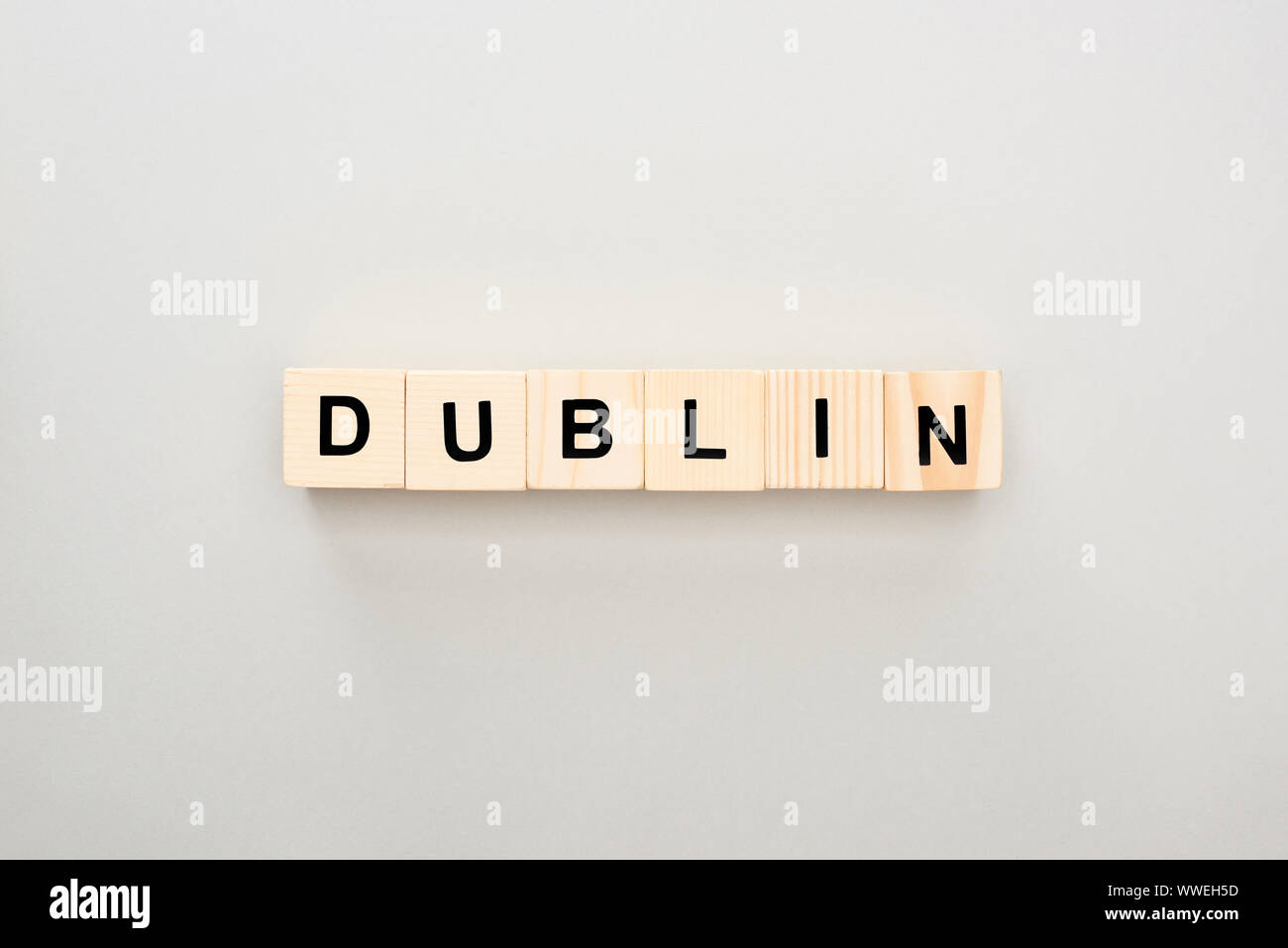 top view of wooden blocks with Dublin lettering on grey background ...