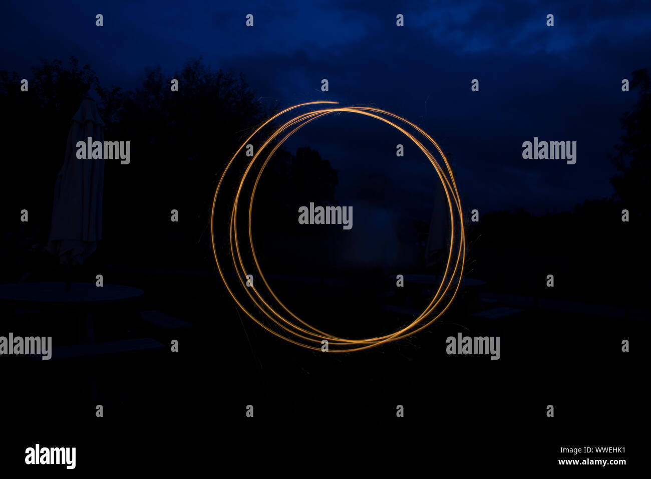 circle in the dark made by a sparkler on a long shutter speed Stock ...