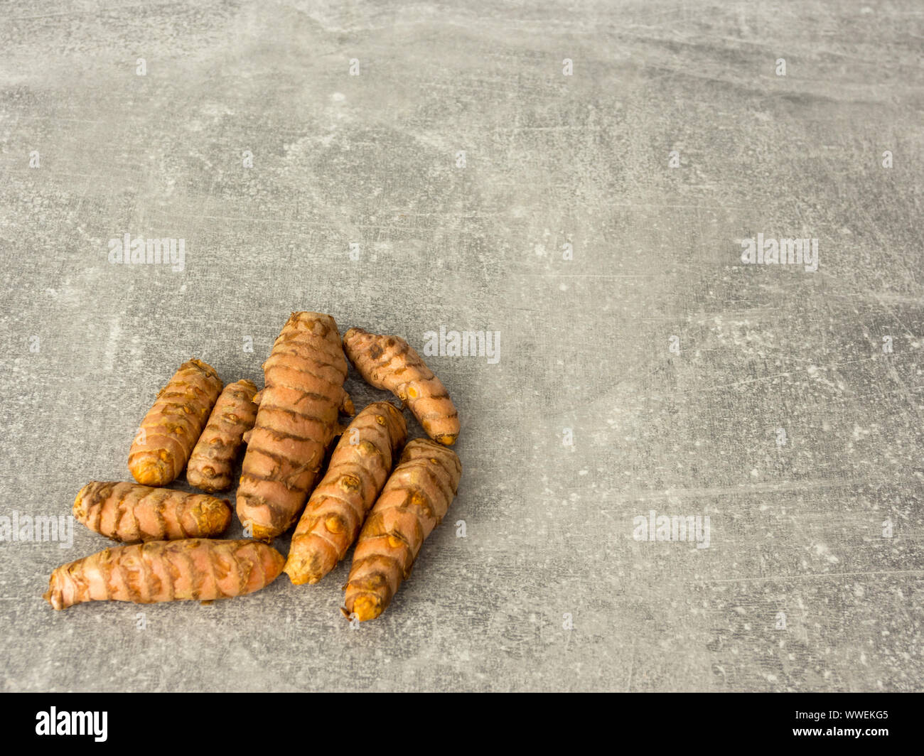 Raw turmeric with roots hi-res stock photography and images - Alamy