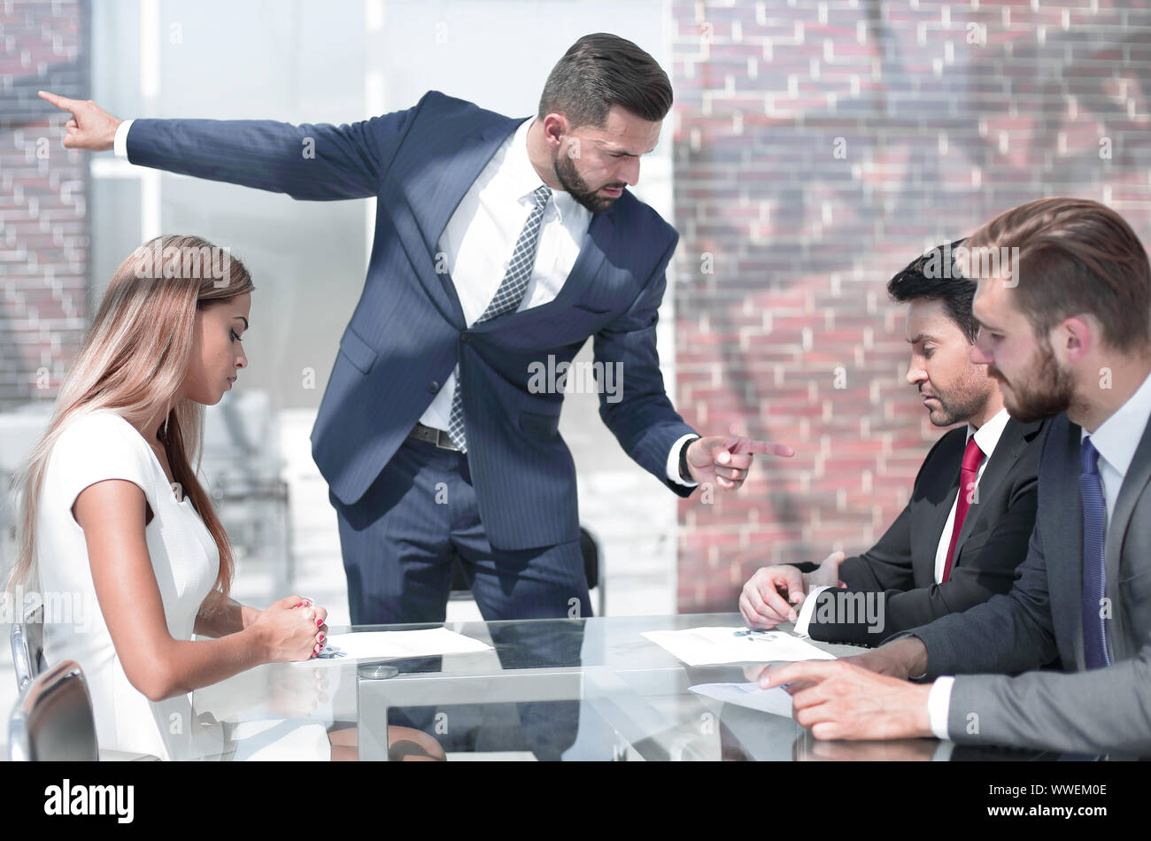 HR Manager talking to employees in the office Stock Photo - Alamy