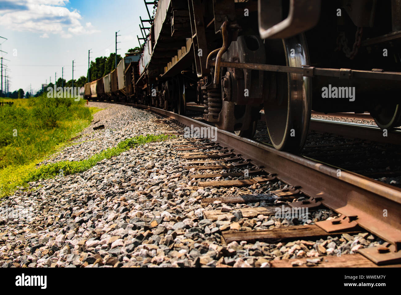 Train Tracks and Railing of Moving Train Stock Photo - Alamy