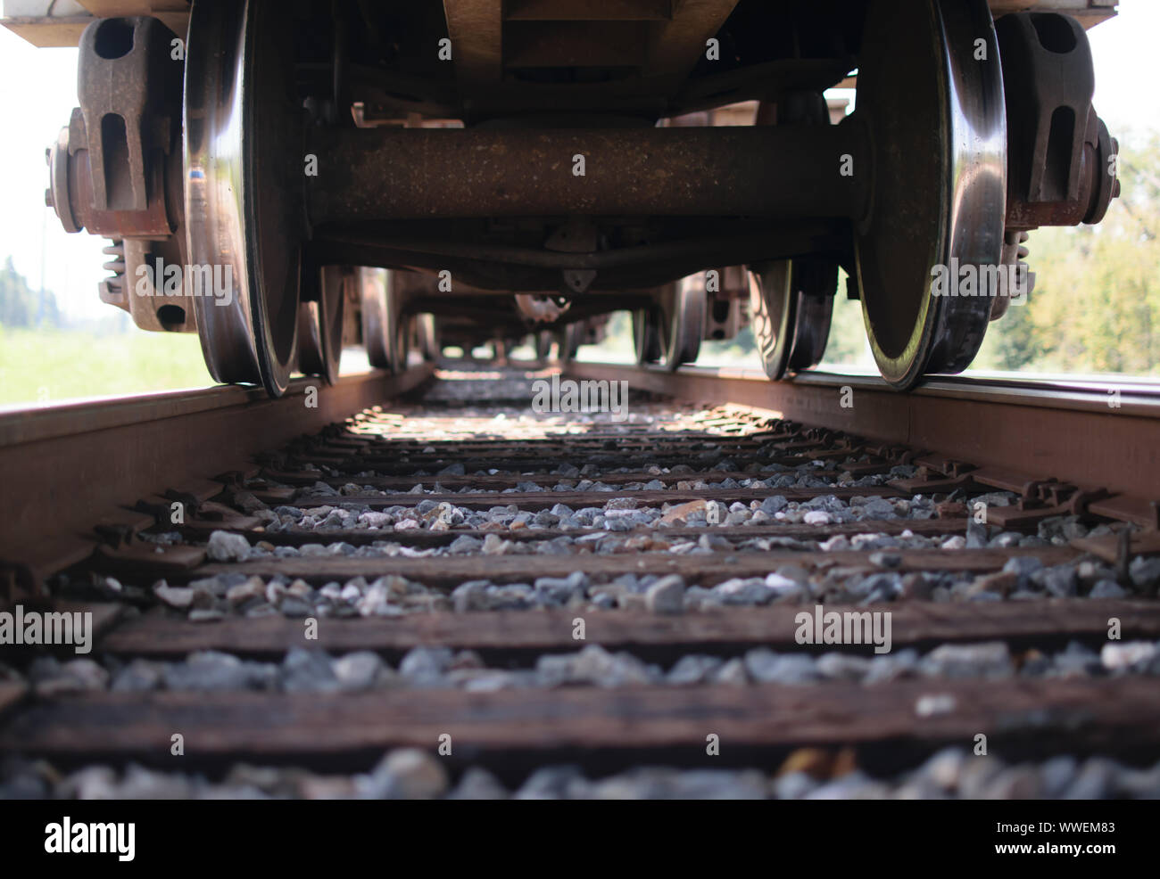 Train Tracks and Railing of Moving Train Stock Photo - Alamy