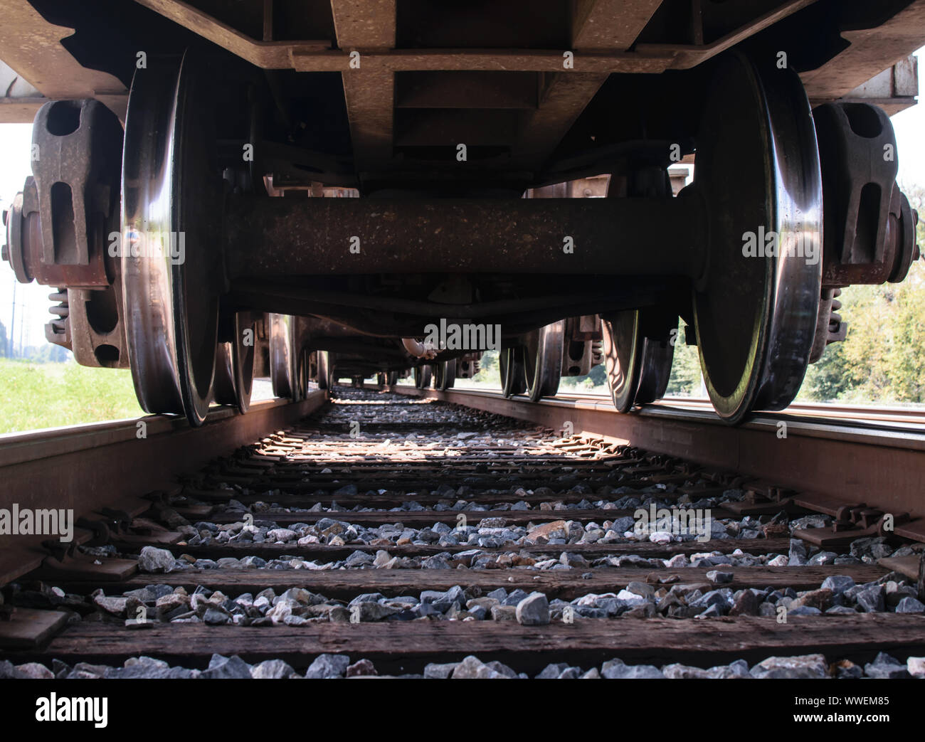 Train Tracks and Railing of Moving Train Stock Photo - Alamy
