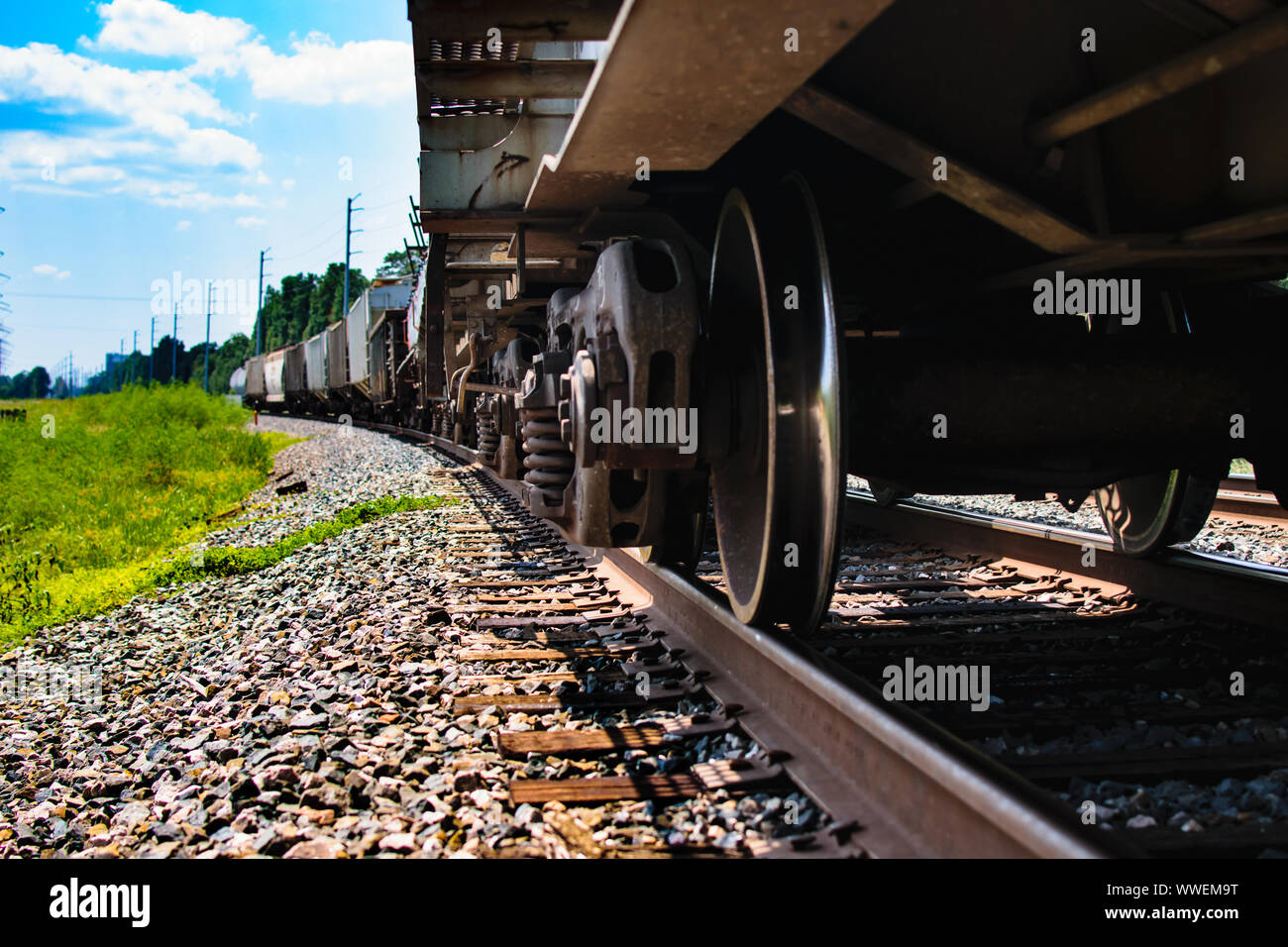 Train Tracks and Railing of Moving Train Stock Photo - Alamy