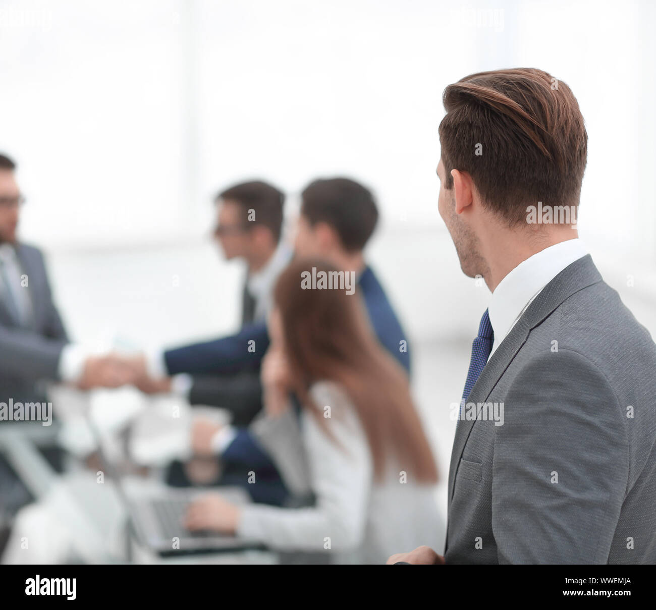 rear view. businessman looking at workplace Stock Photo - Alamy