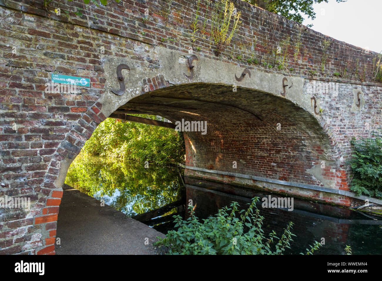View of a typical small, low brick-built arch road bridge over the ...