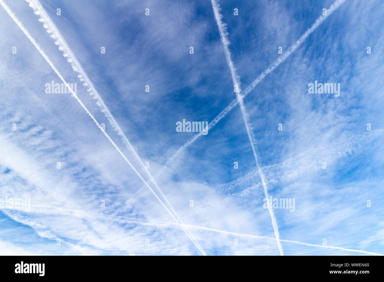Contrails in the sky, geometric shapes, triangle and crossing lines ...