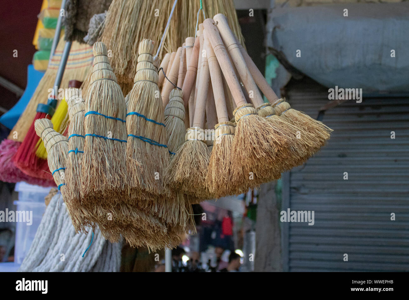 Handmade broom in front of the store selling cleaning products. Other ...