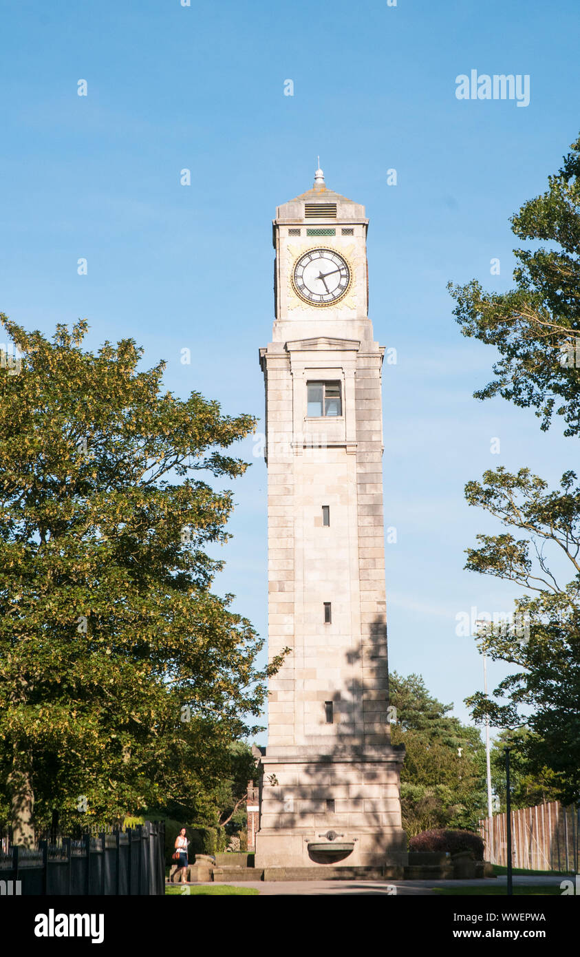 Lady by the Cocker Clock Tower on a sunny day in Stanley Park Blackpool ...