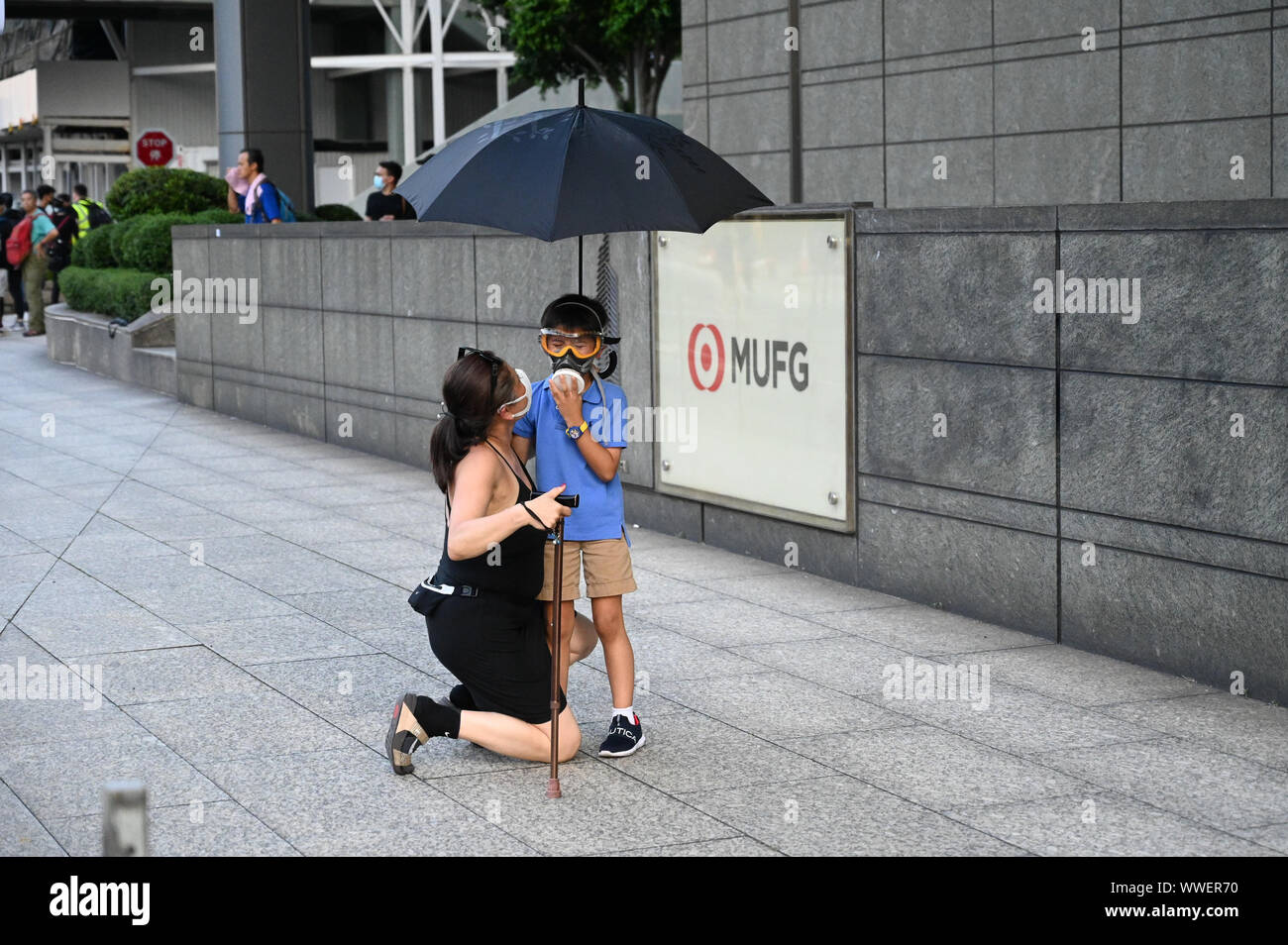 Hong Kong, Hong Kong Sar. 15th Sep, 2019. A mother and son wearing a ...