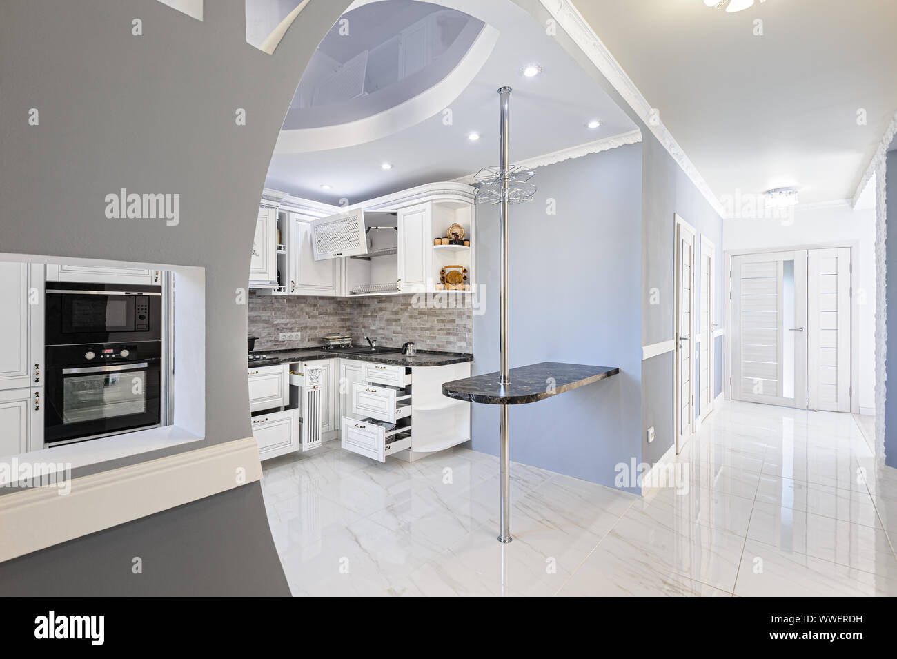 Luxury modern white colored kitchen interior with corridor Stock Photo ...