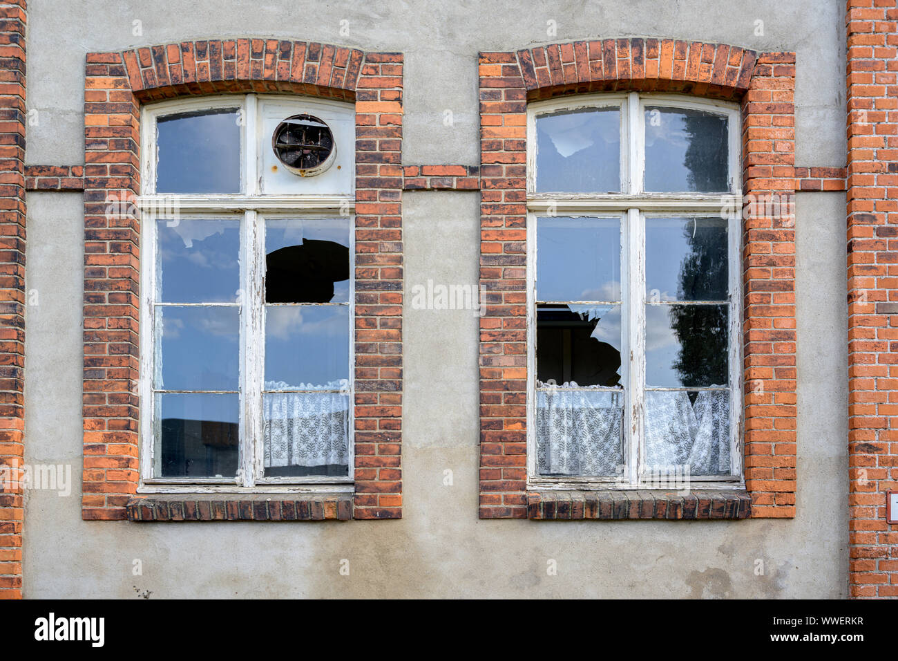 broken window panes in an older house, vandalism concept Stock Photo ...
