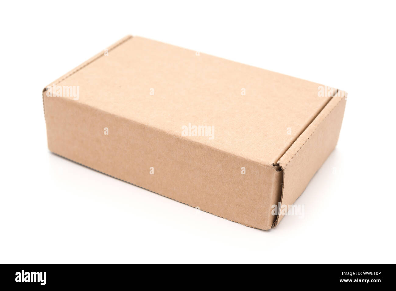 closed brown box on a white background Stock Photo - Alamy