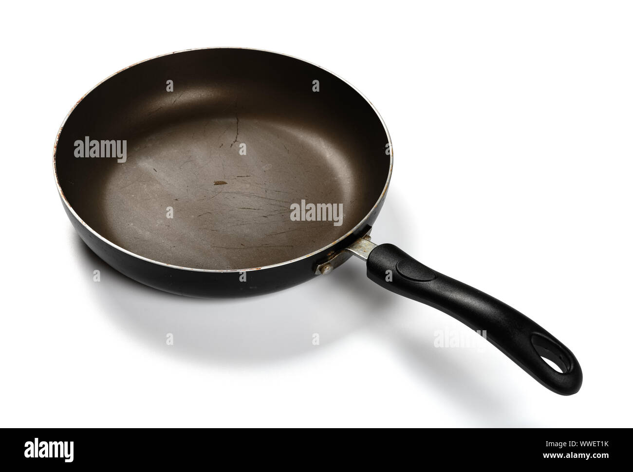 an used metal pan on white background Stock Photo - Alamy