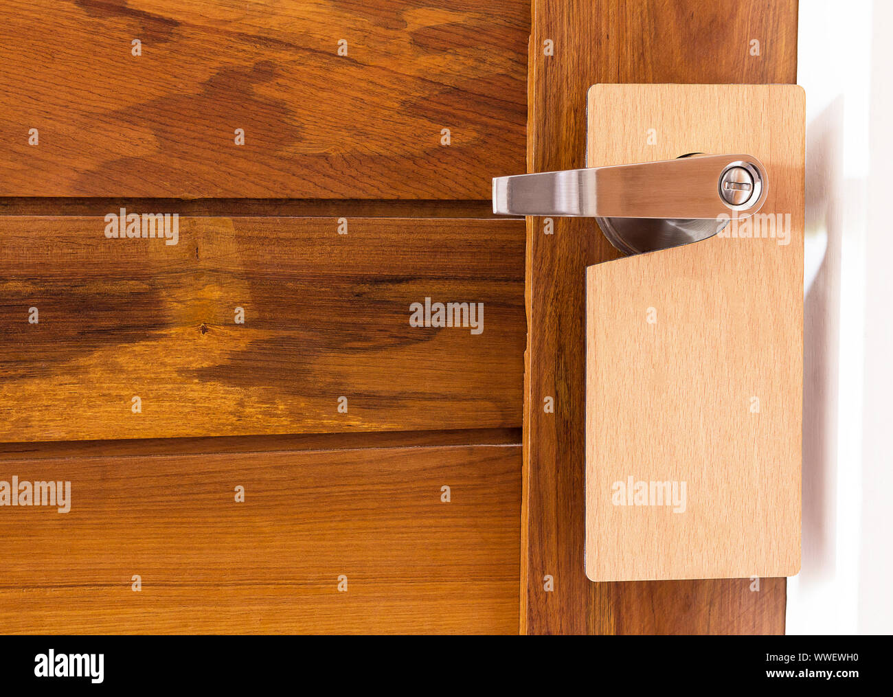 Wood room label hanging on door handle, space for adding text Stock ...