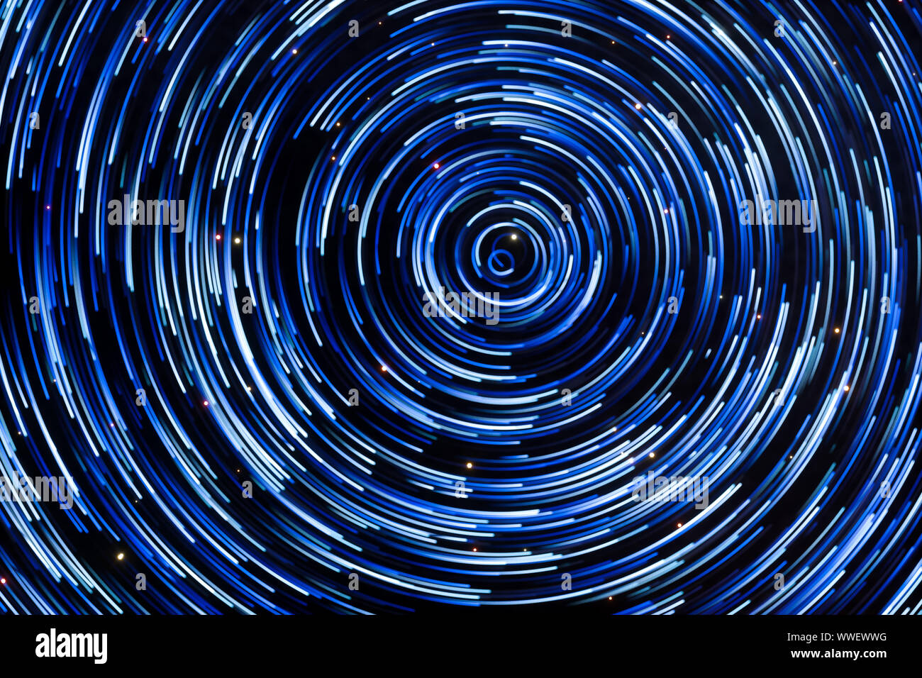 Particles revolves around its center with dark background, 3d rendering ...