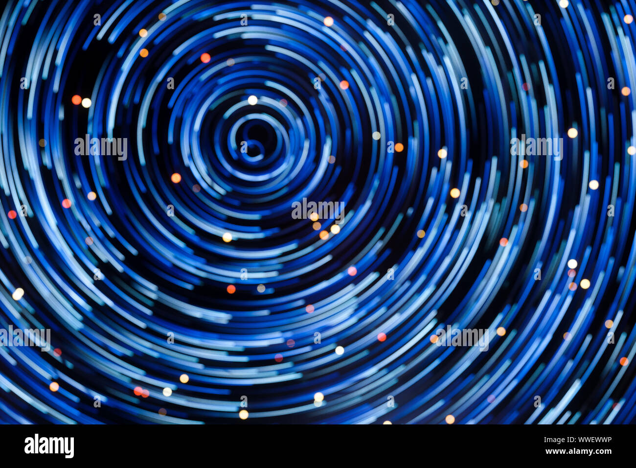 Particles revolves around its center with dark background, 3d rendering ...