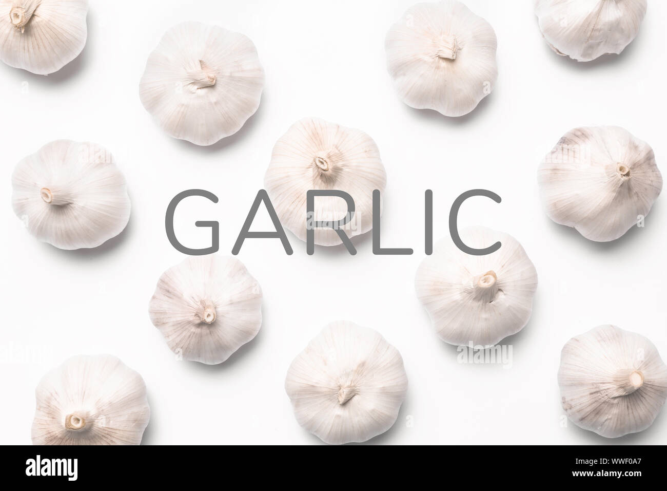 Many fresh garlic on white background Stock Photo - Alamy