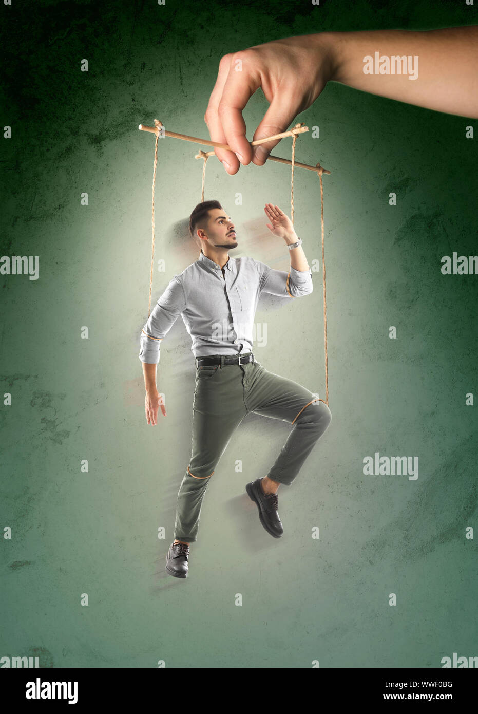 Man hand puppet strings hi-res stock photography and images - Alamy