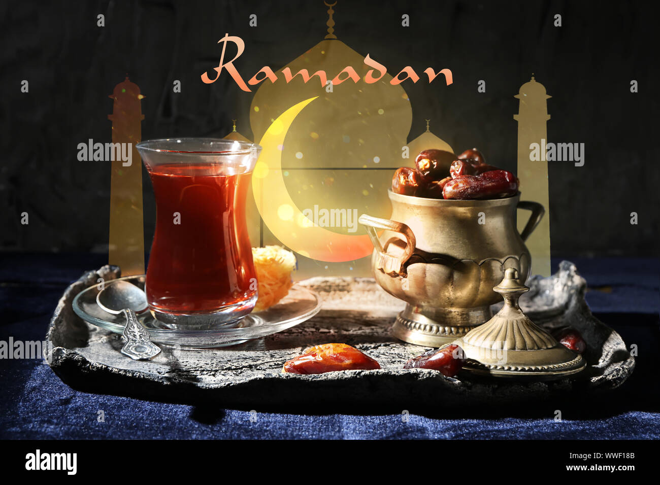 Composition with tasty Turkish tea and dates on table. Ramadan ...