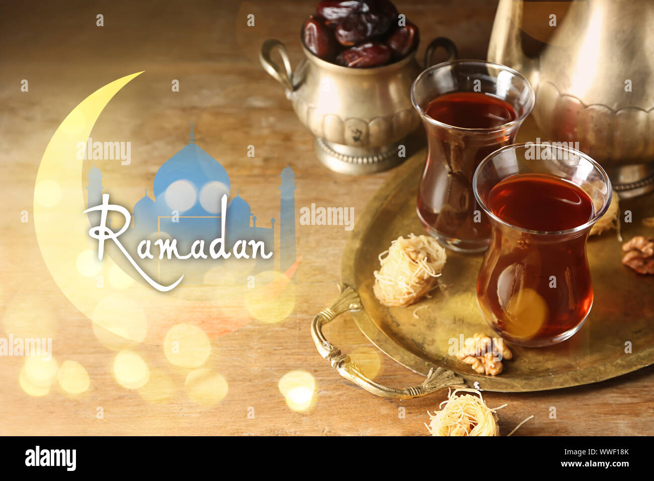 Composition with tasty Turkish tea and sweets on wooden table. Ramadan ...