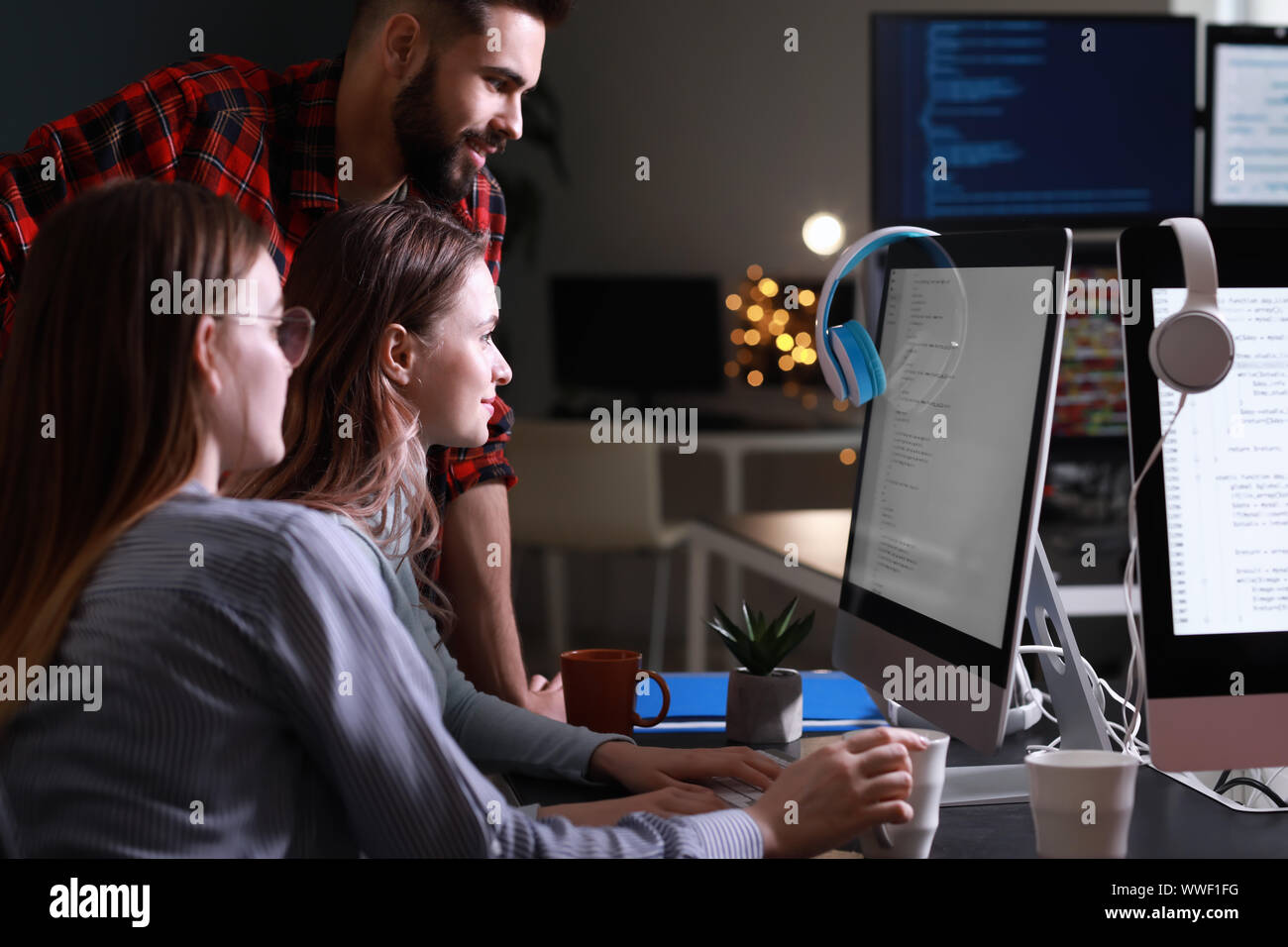 Team of programmers working in office Stock Photo - Alamy