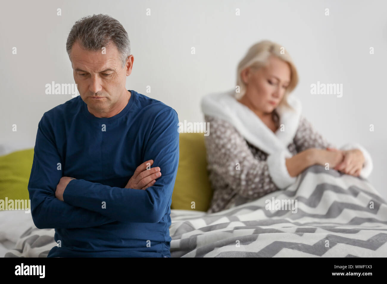 Offended husband angry with his wife at home Stock Photo - Alamy