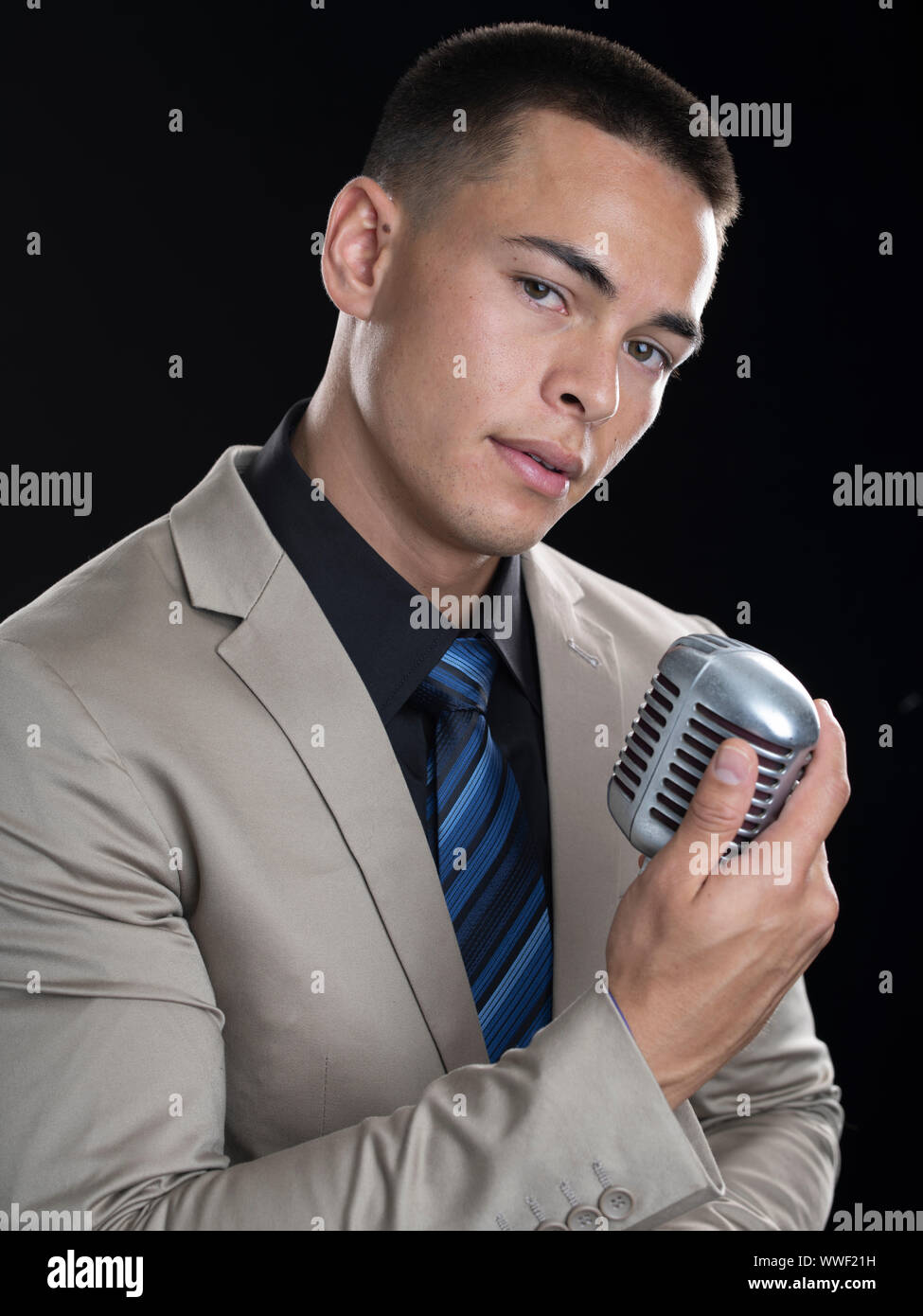 Singer with microphone Stock Photo - Alamy