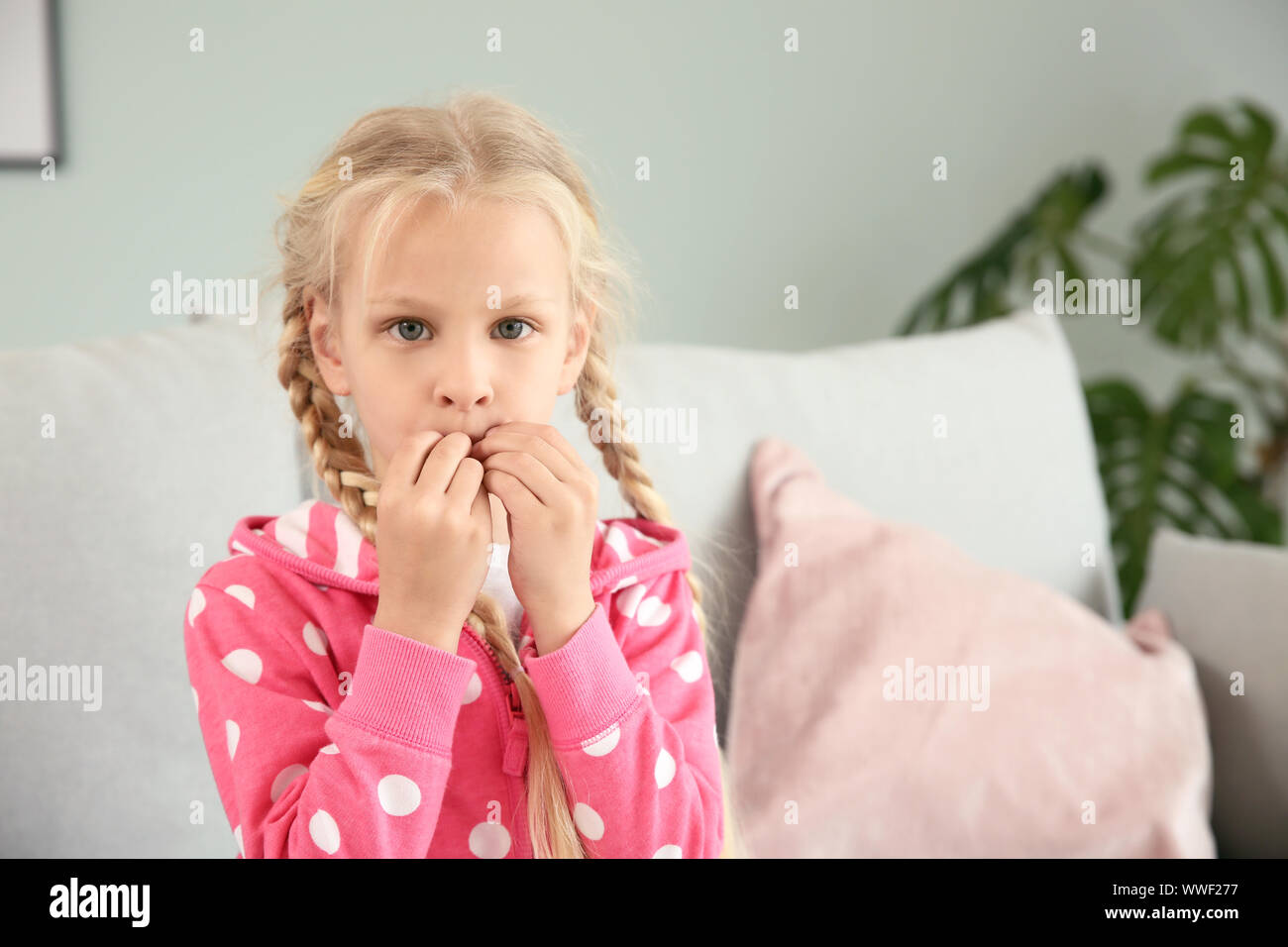 Little deaf mute girl using sign language at home Stock Photo - Alamy