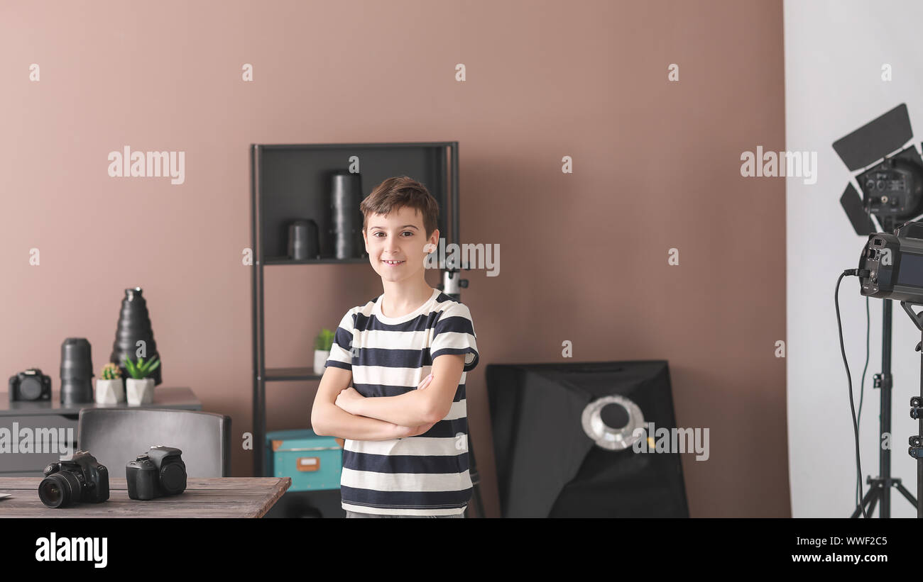 Cute little photographer in professional studio Stock Photo - Alamy