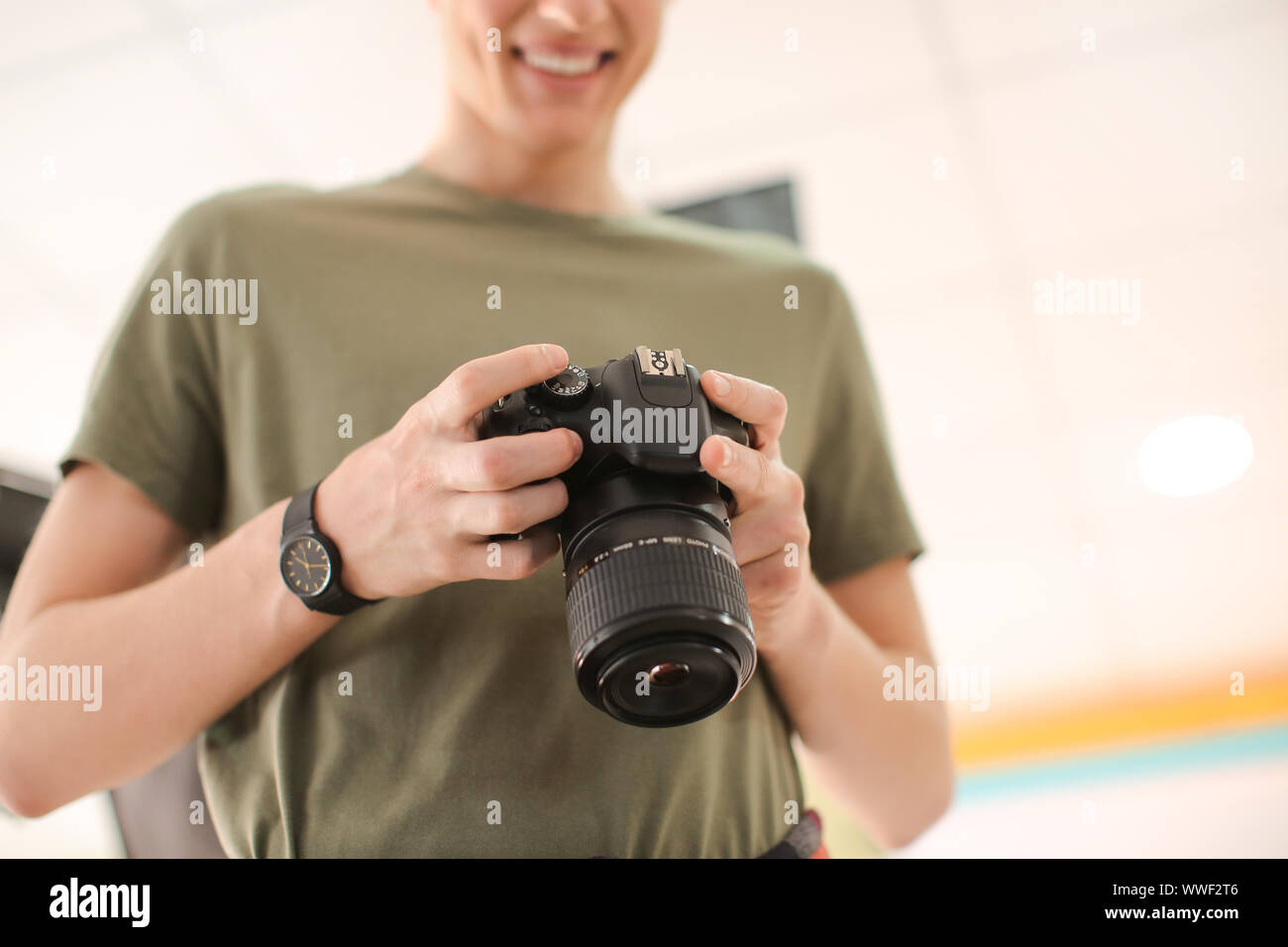 Teenage photographer in professional studio Stock Photo - Alamy